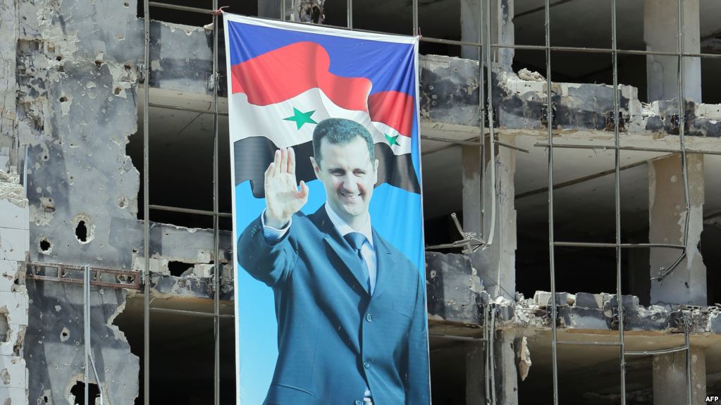 Assad or the Naked Lion – Hummus For Thought